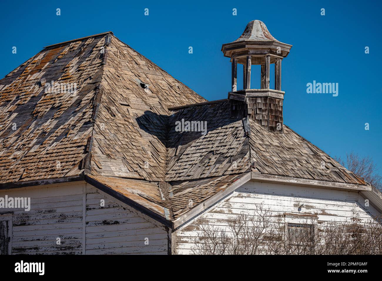An aged wooden barn, featuring a tower at its apex Stock Photo - Alamy