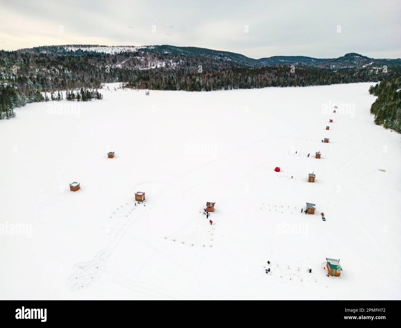 Canada, Quebec Province, Lac Saint Charles, fishermen in ice holes ...