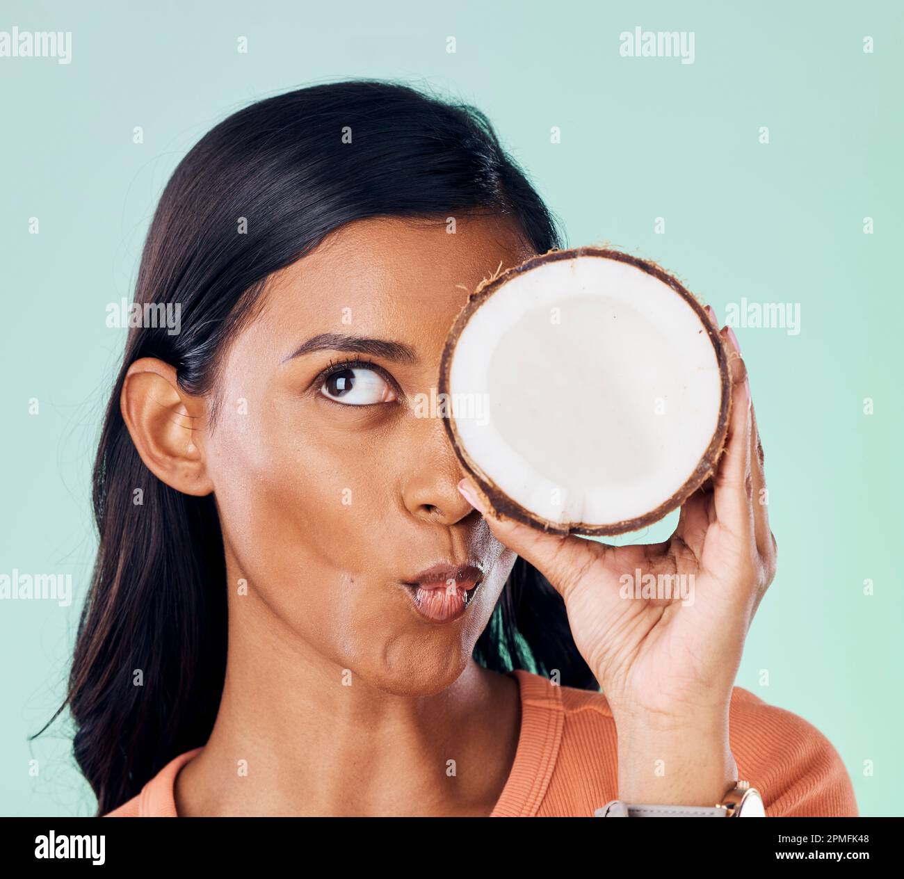 Beauty, face or wellness woman with coconut for natural skincare glow ...