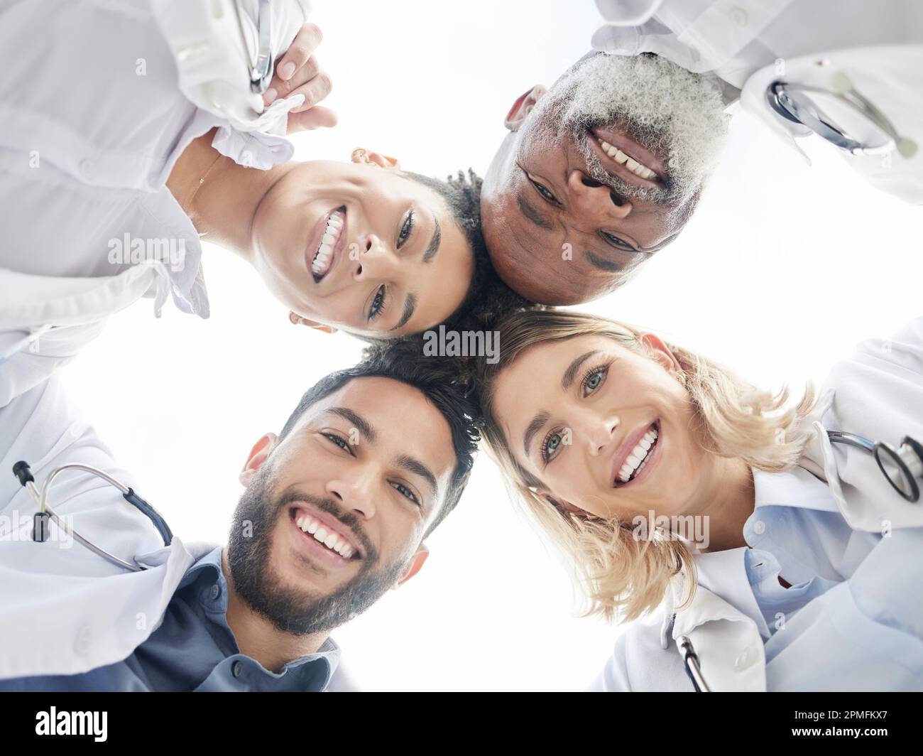 Below portrait, doctors and circle in team building closeup for ...
