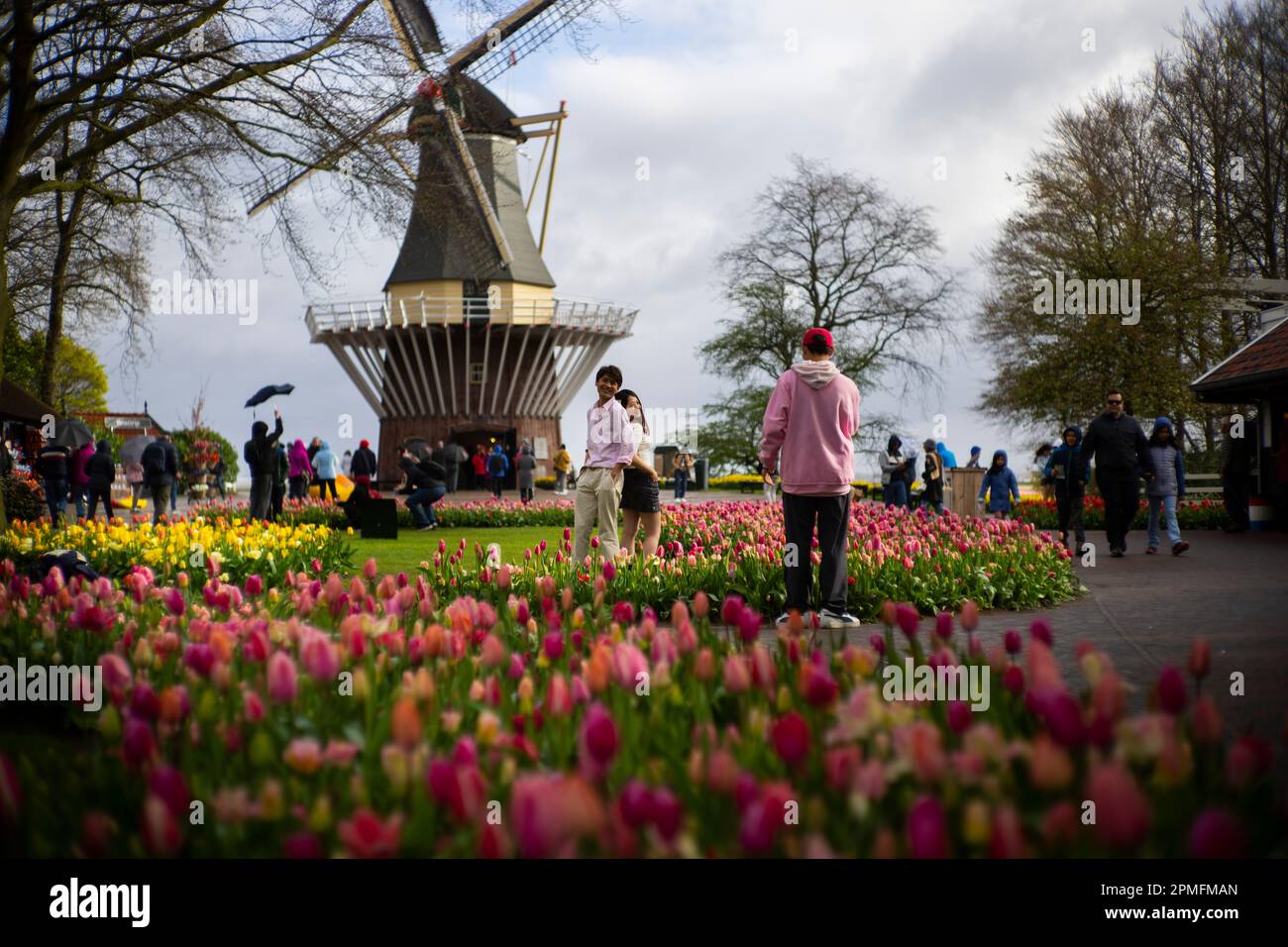 Tourists pose for pictures at the world-renowned Dutch flower garden ...