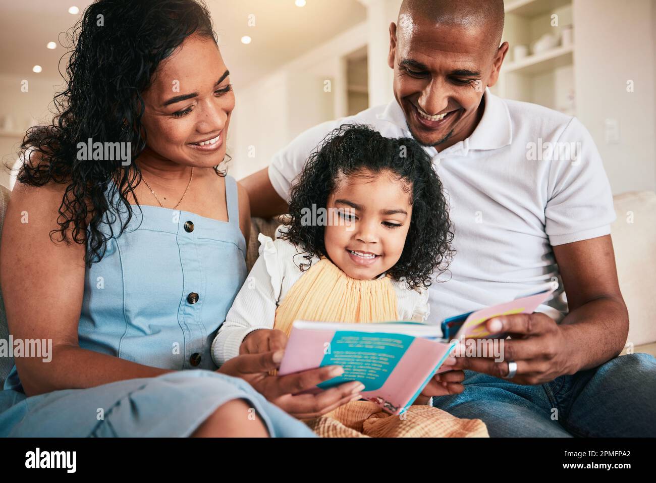 Family, happy and child reading story book, cartoon comic books and ...