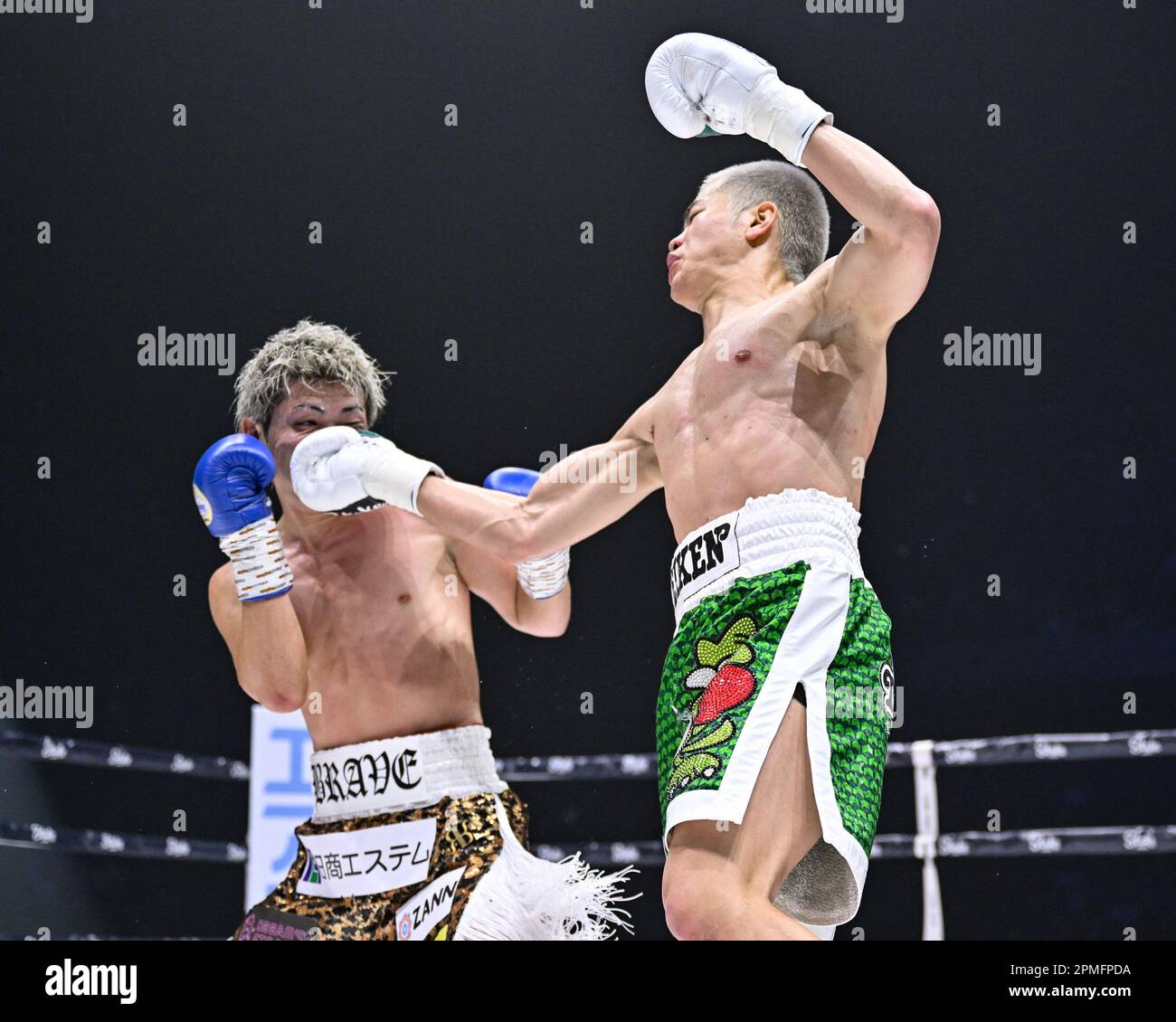 Tenshin Nasukawa (R) and Yuki Yonaha compete during their super-bantamweight boxing bout at ...