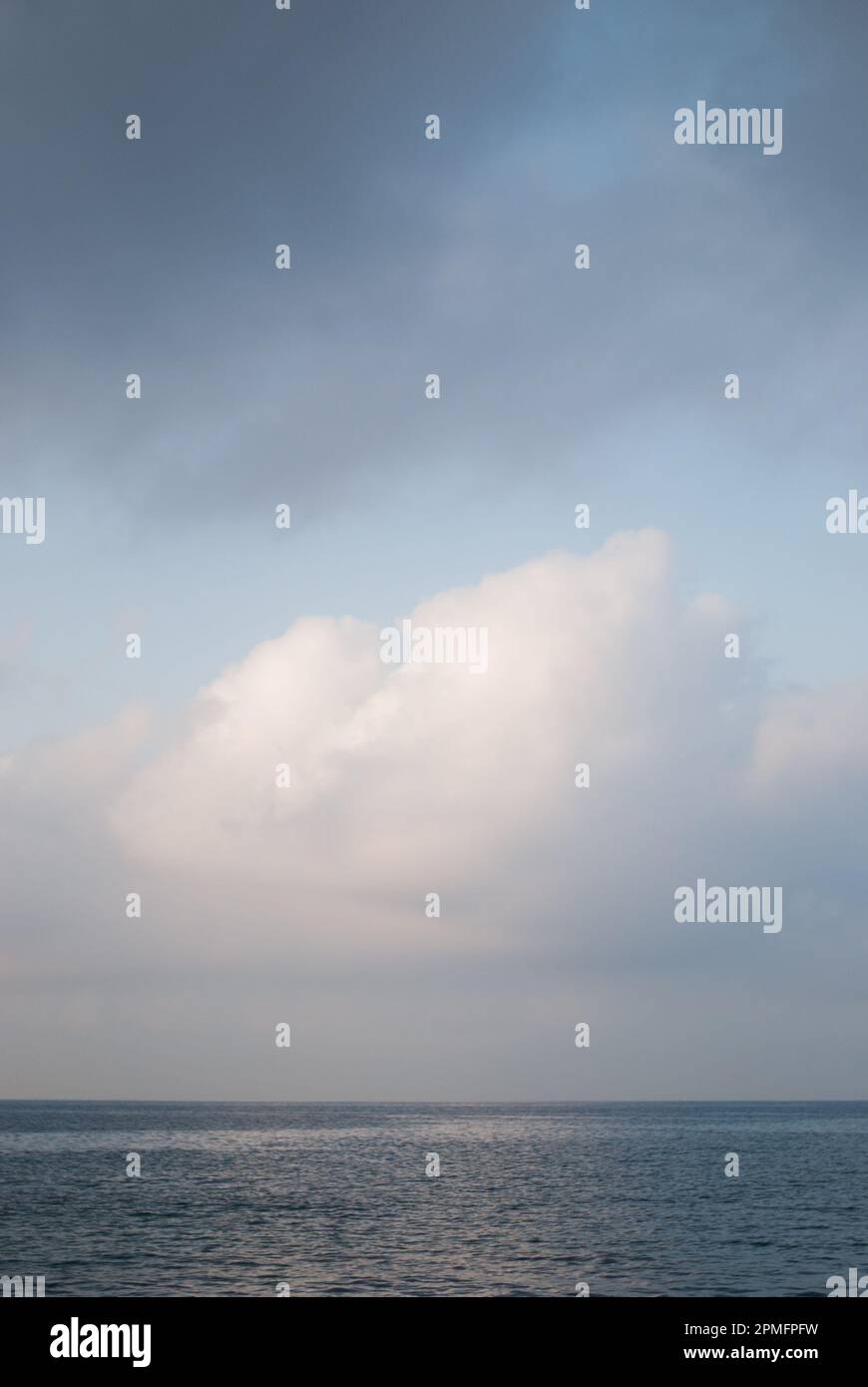 View of white clouds over calm ocean Stock Photo - Alamy