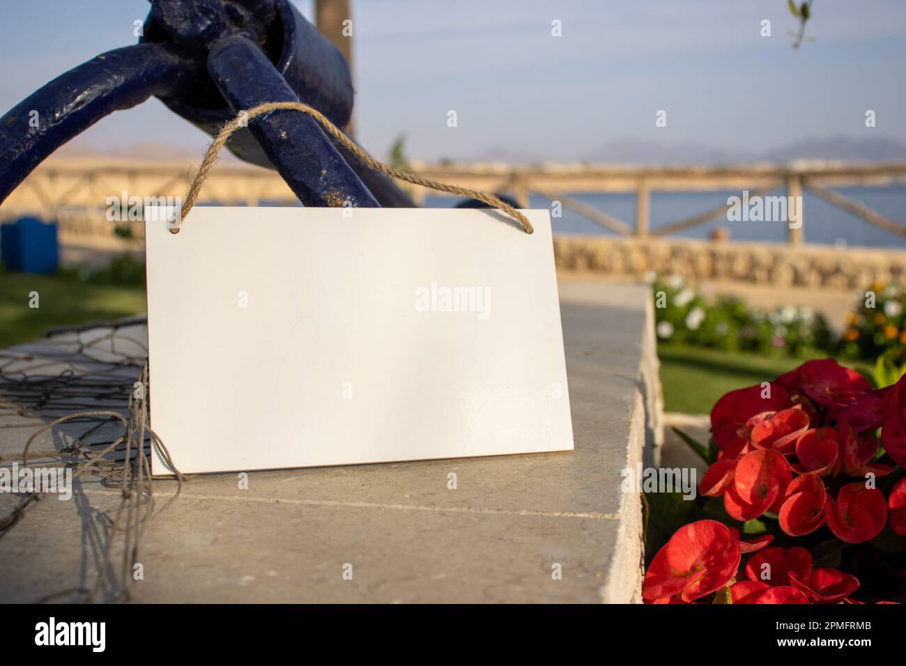 white hanging picture sign with empty free space for template or blank ...