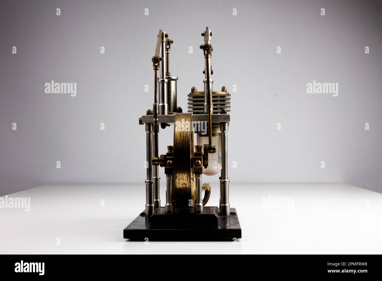 close up of a stirling engine construction with white table and white ...