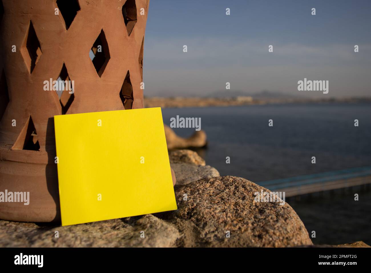 yellow square paper note and tropical blue sea with empty free space ...