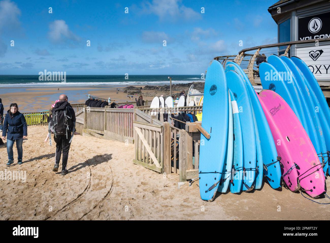 Colourful surfboards stacked and available to hire at the surf hire ...