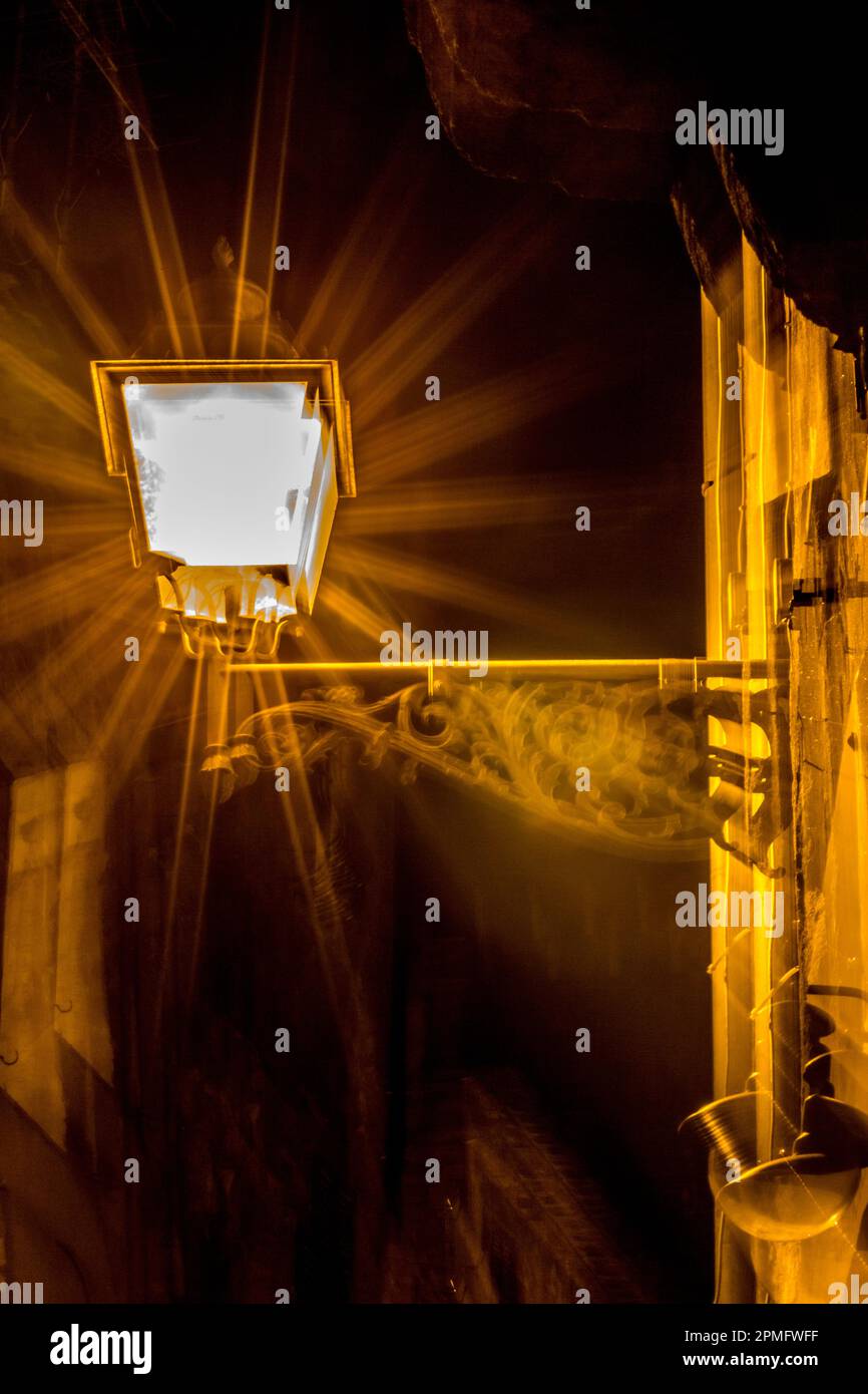 Zoom burst long exposure night photograph of street lamp with star ...