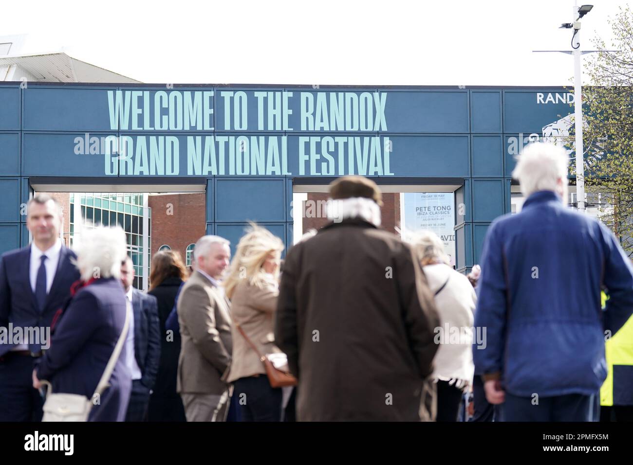 Racegoers arrive during day one of the Randox Grand National Festival ...