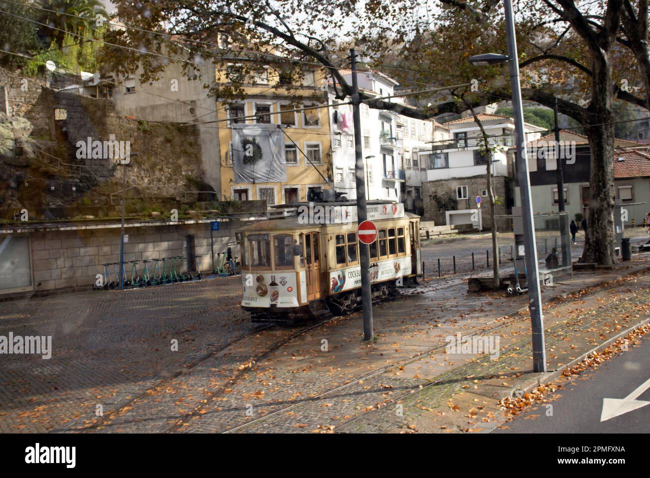 PORTO, PORTUGAL - OCTOBER 31, 2022 city street with traditional tram ...