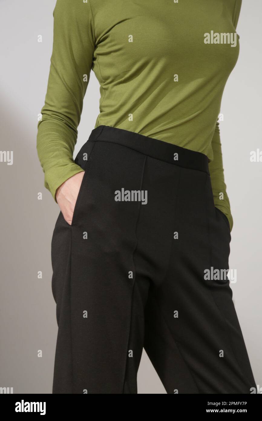 Serie of studio photos of young female model wearing comfortable basic ...