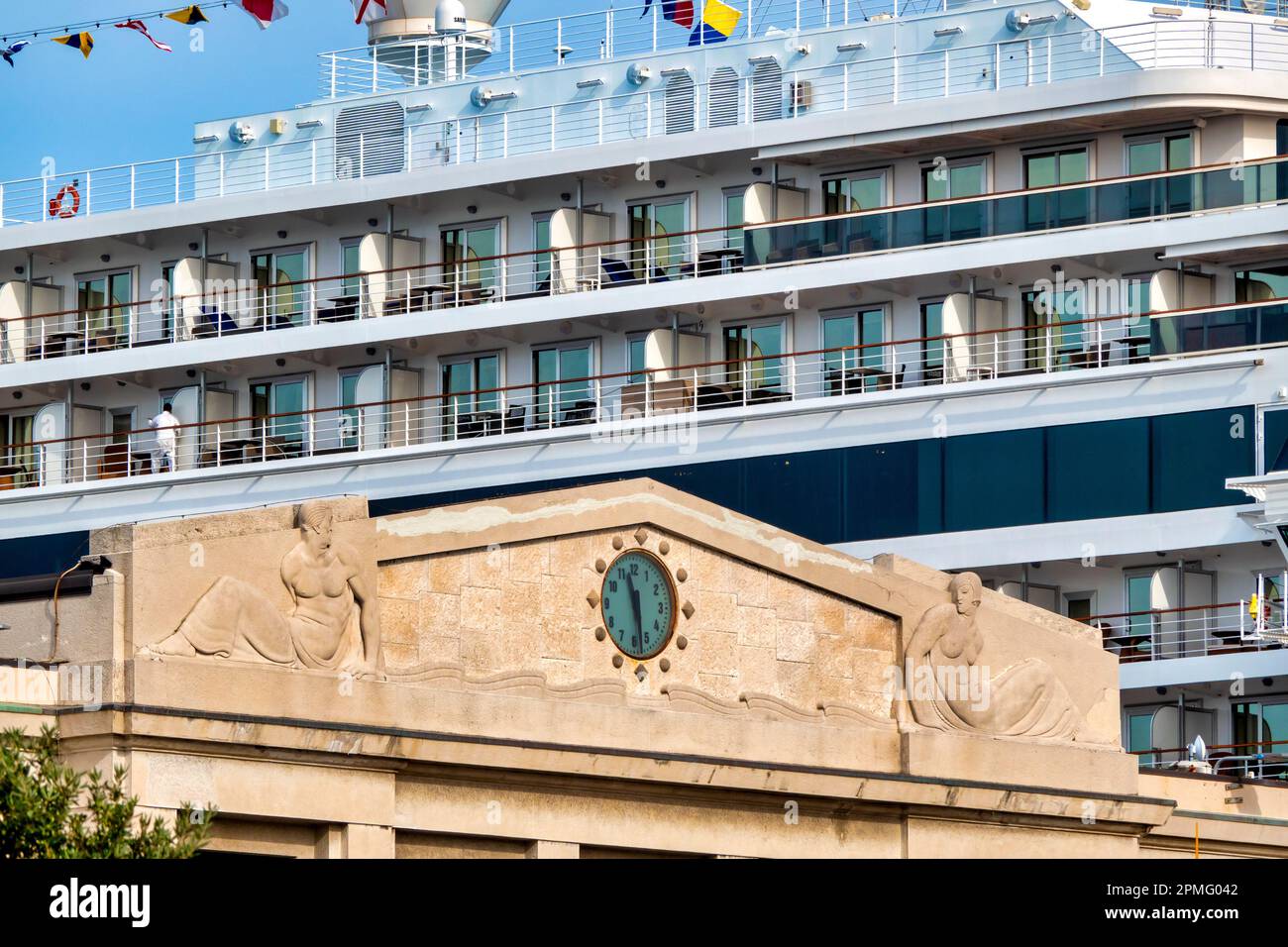 Detail of the facade of the Stazione Marittima with a cruise ship in ...
