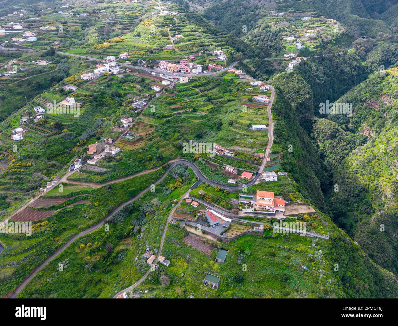 A volcanic gorge covered with dense green vegetation. San Juan at ...