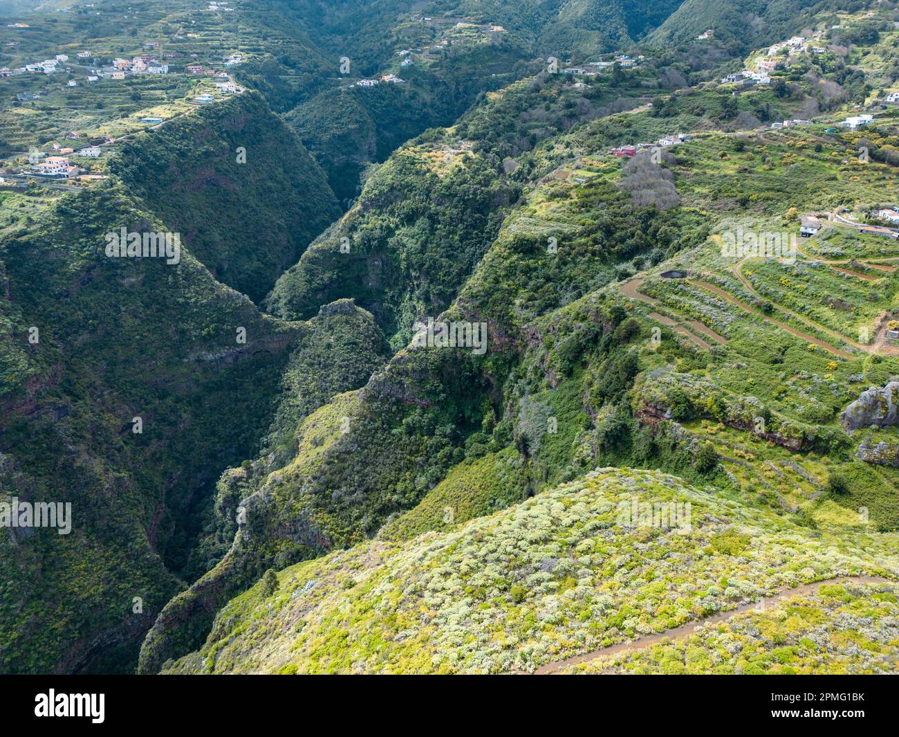 A volcanic gorge covered with dense green vegetation. San Juan at ...