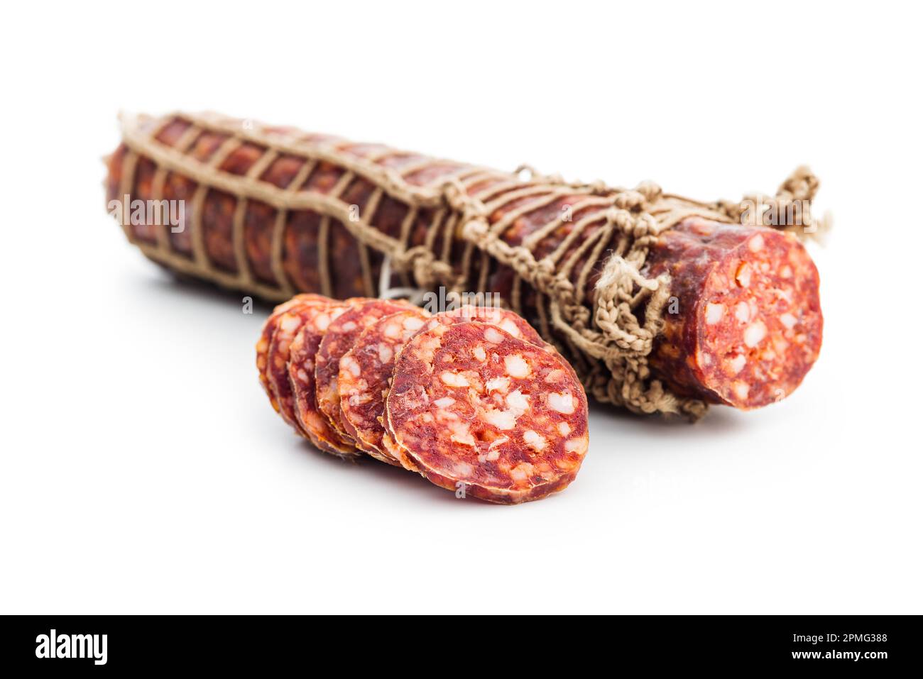 Smoked sausage. Sliced salami isolated on the white background Stock Photo - Alamy