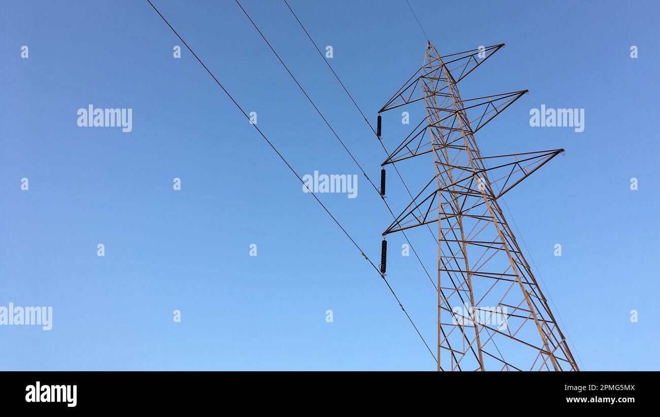 Electricity transmission towers with glowing wires Stock Photo - Alamy