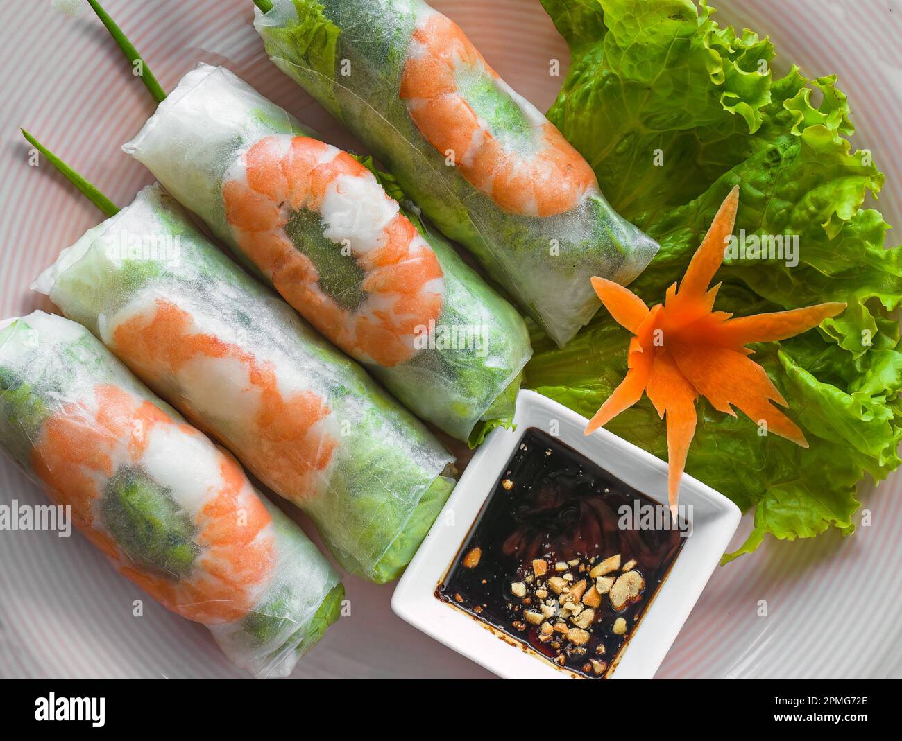 Traditional vietnamese spring rolls with shrimps, rice paper close up ...