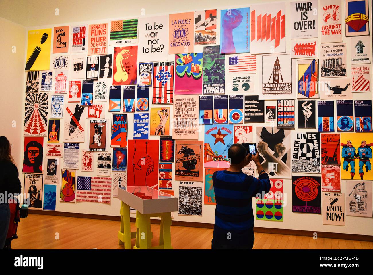 Amsterdam, Netherlands. January 2023. Visitor takes photo of a wall ...