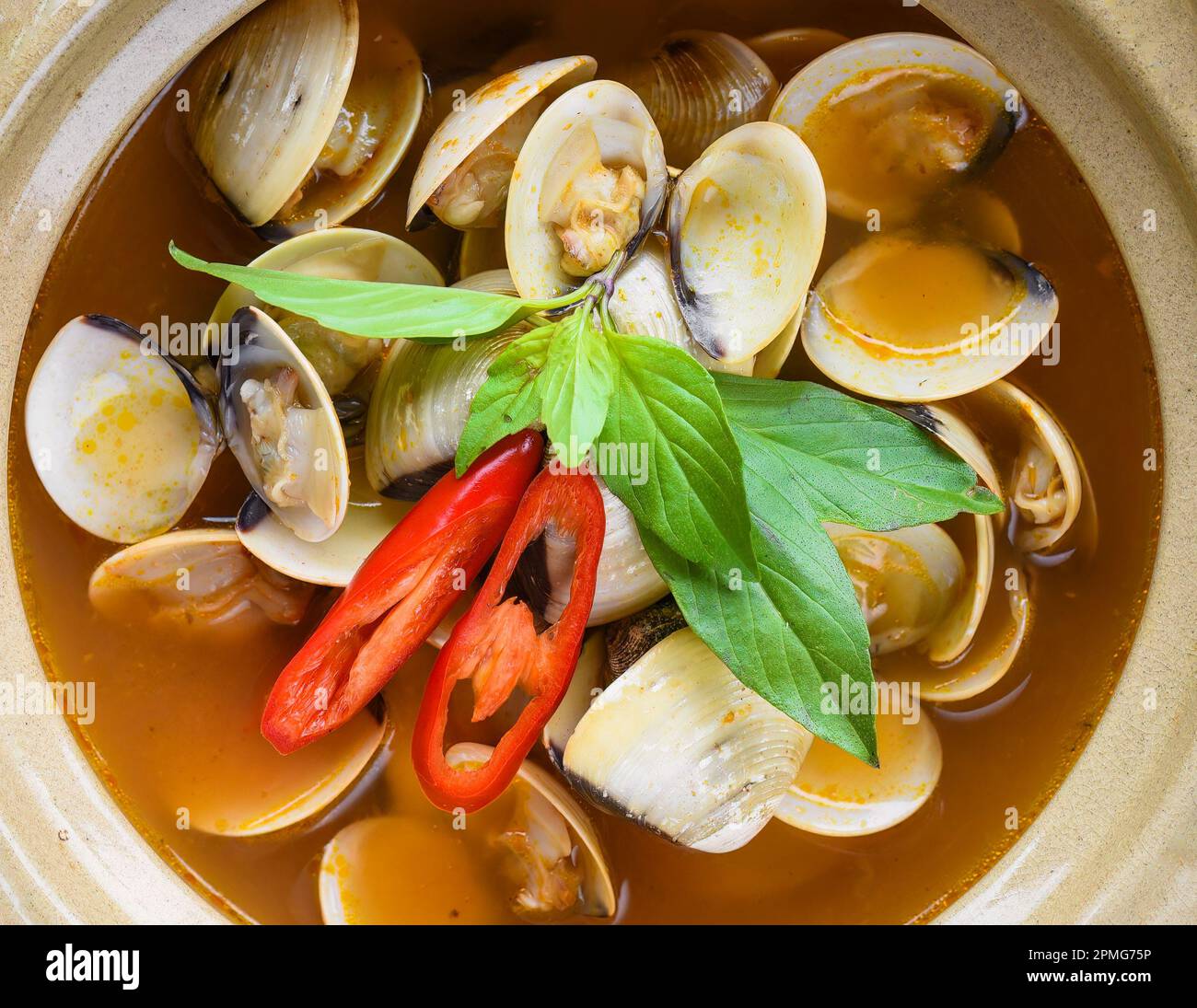 Steamed clams or clam soup cooked in vietnamese style isolated on black ...