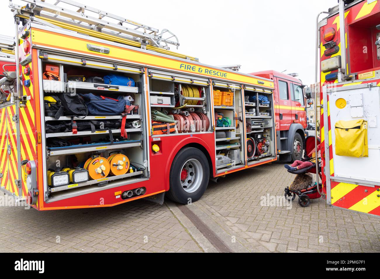 April 2023 - Open side of a modern fire engine showing its kit at the ...