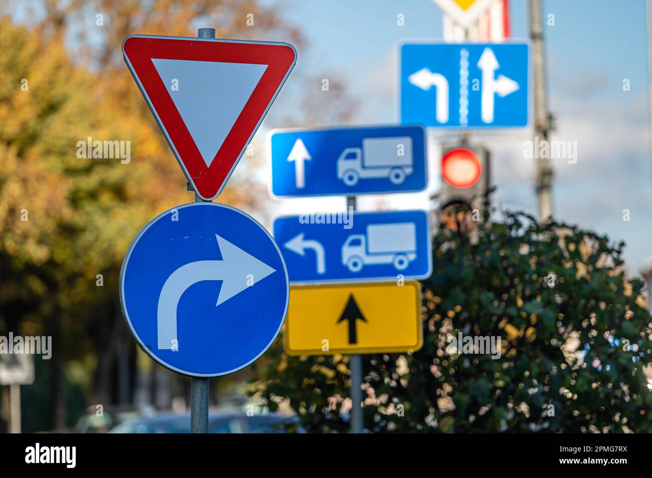 Cars moving on the road in city. View to the traffic with signs ...