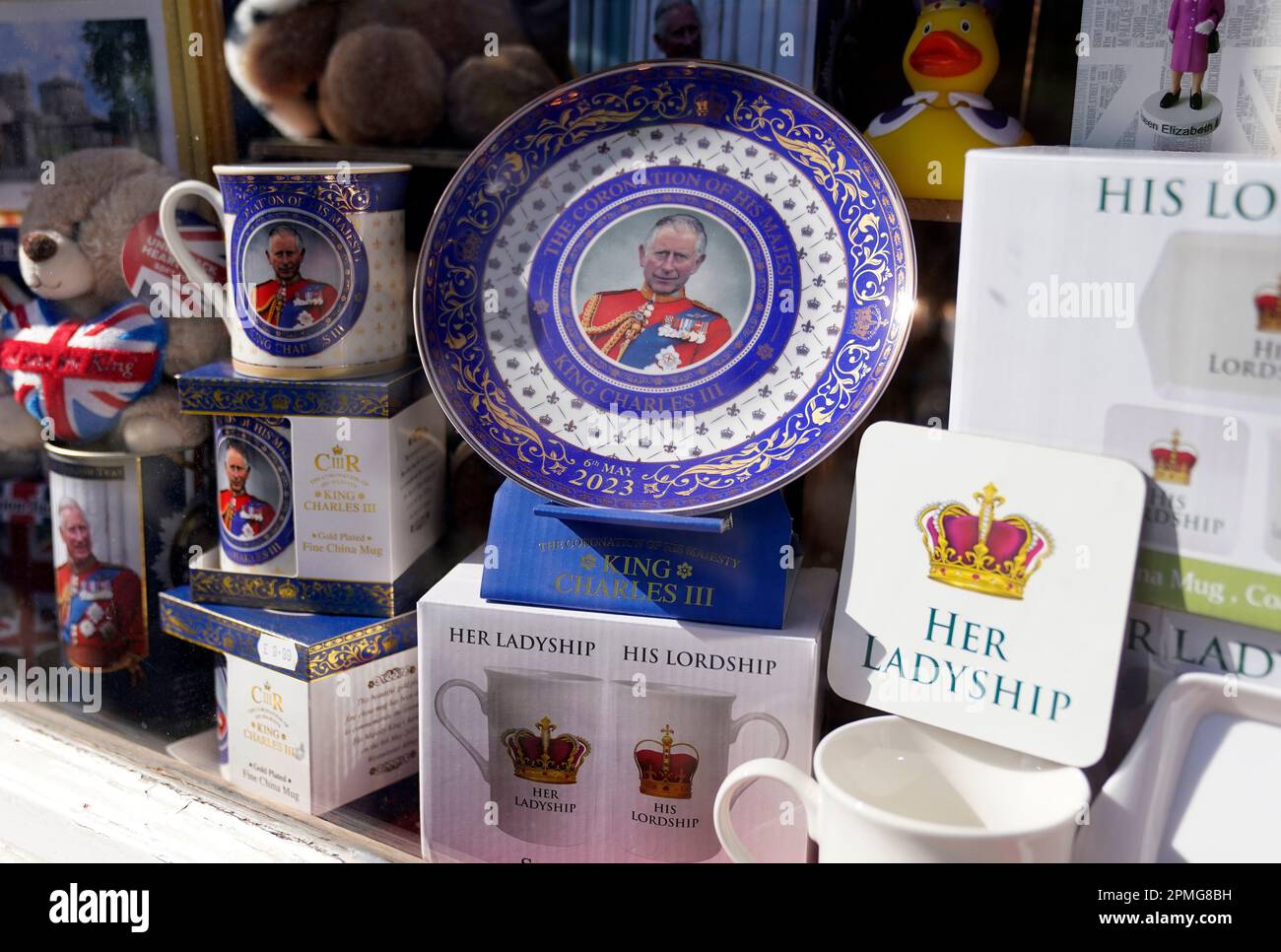 King Charles III and coronation merchandise on display in a shop window ...