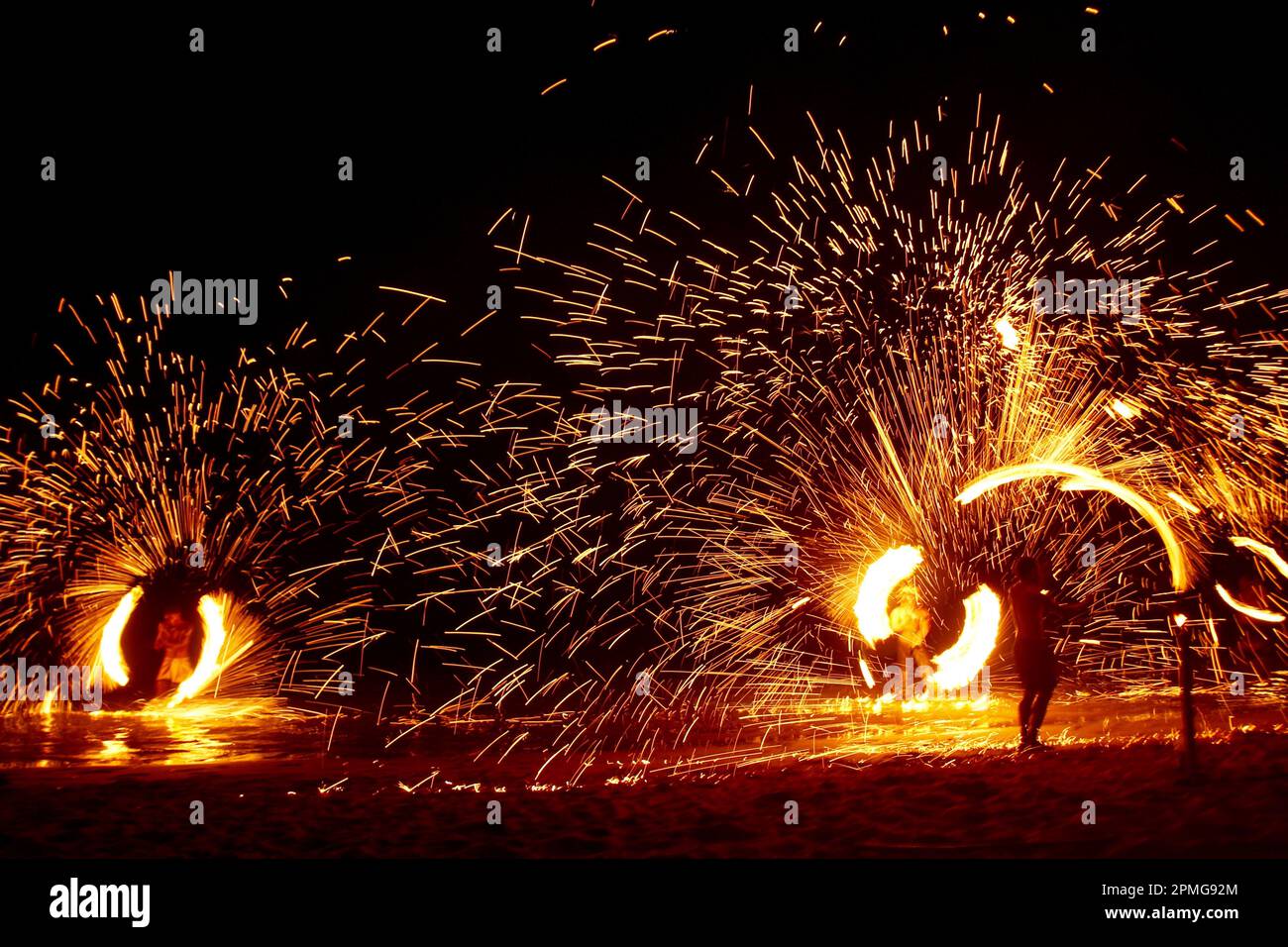A group of performers create a mesmerizing fire show, with the light ...