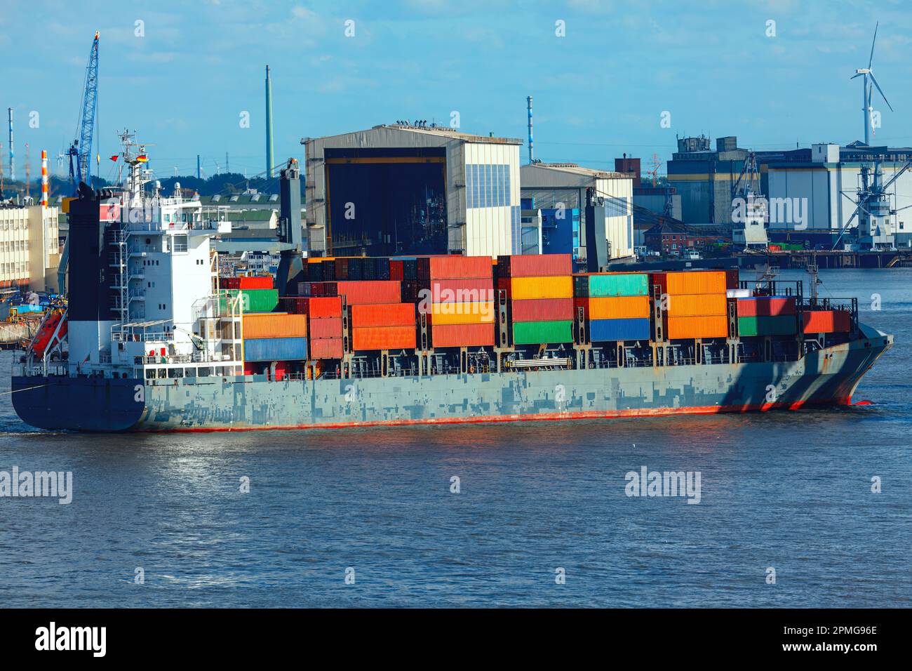 Cargo ship with containers in industrial port Stock Photo - Alamy