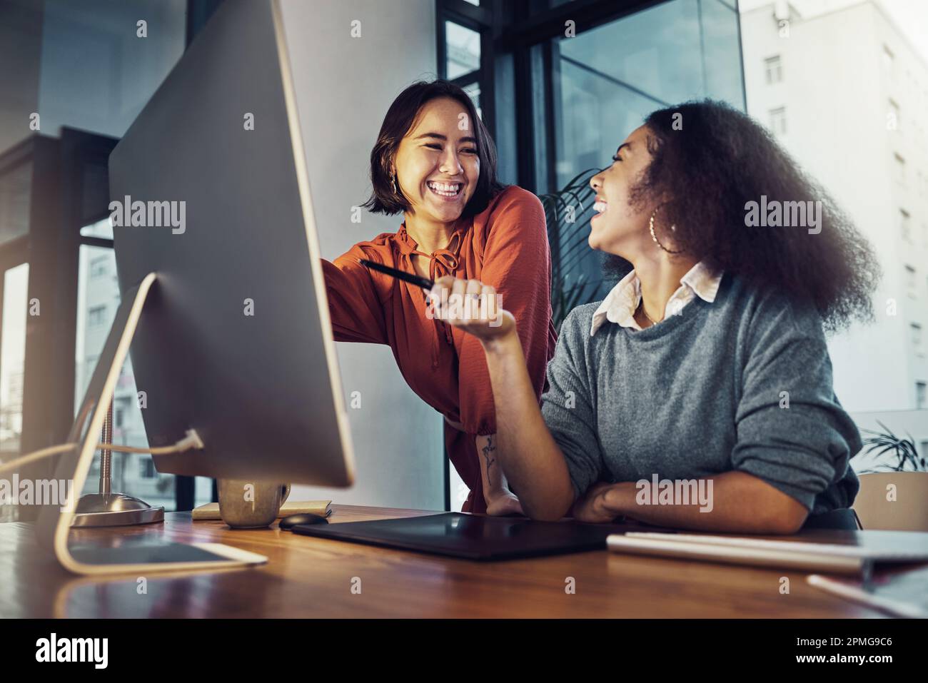 Collaboration, computer and business women in the office while working ...