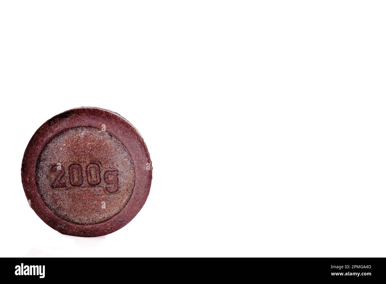 Close up of rusty standard metric 200g weight made of iron for weighing ...