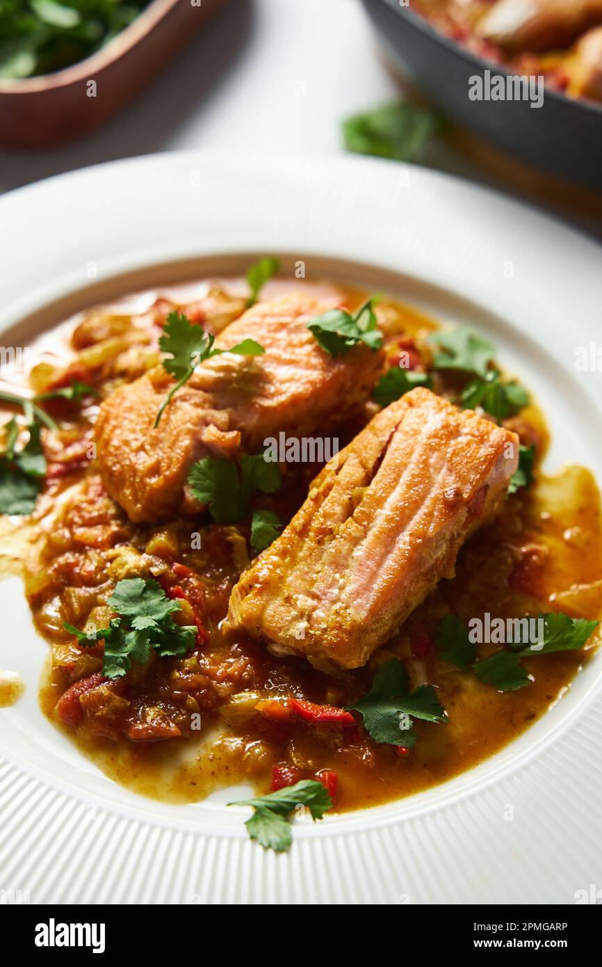 Indian red salmon curry with tomatoes. Asian Cuisine. Tomato-infused ...