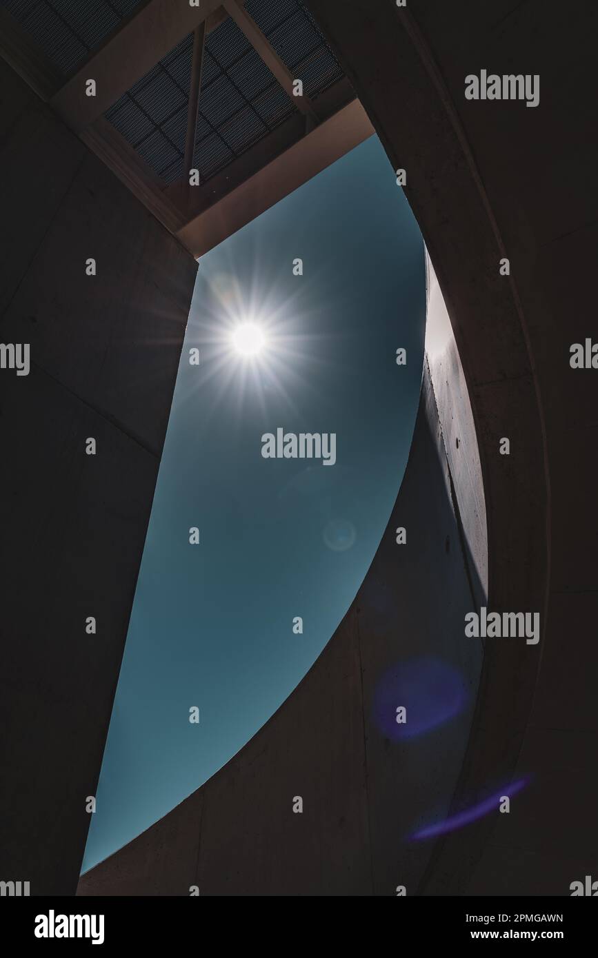Sun with rays between the walls of a modern building Stock Photo - Alamy