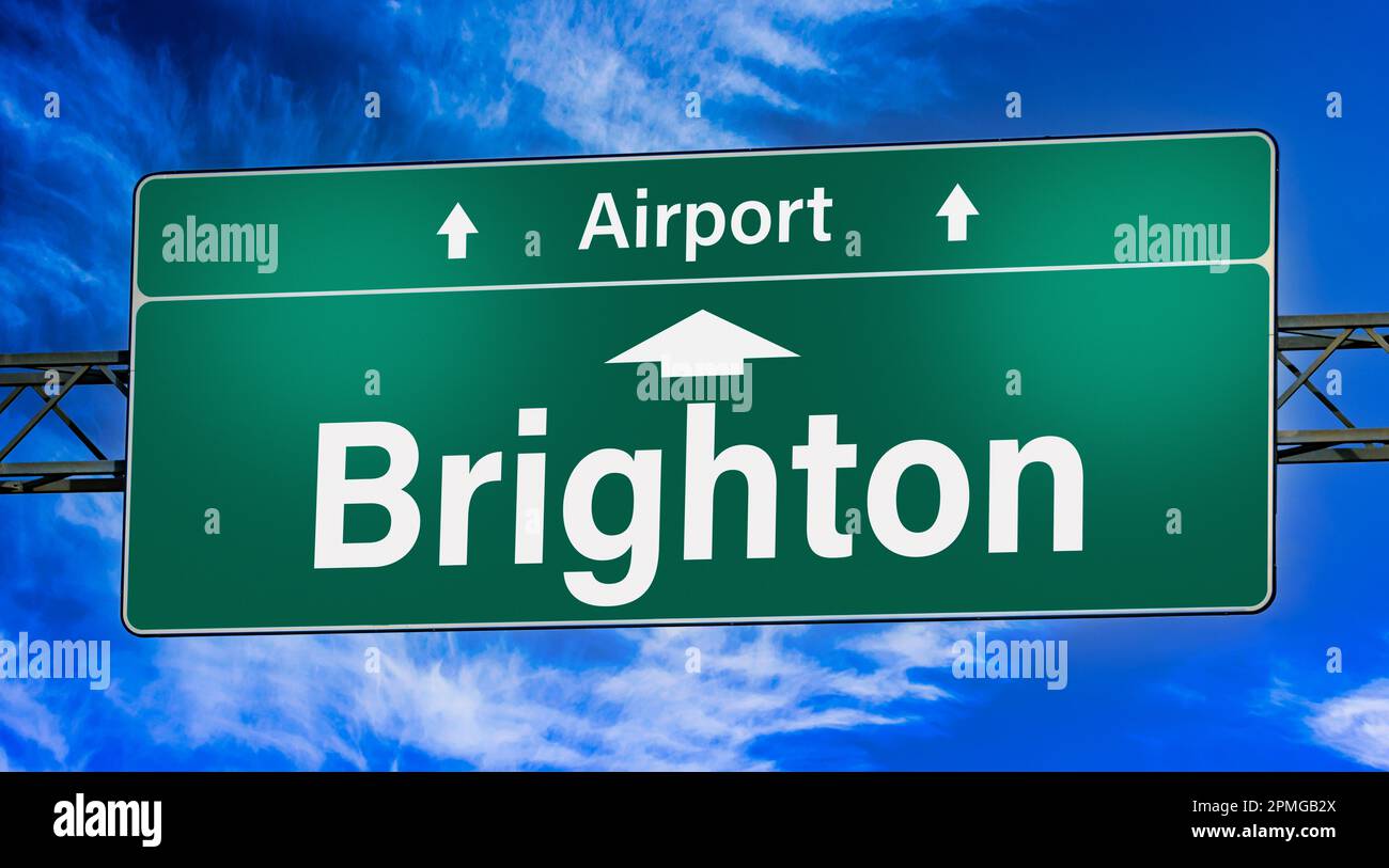 Road sign indicating direction to the city of Brighton Stock Photo - Alamy