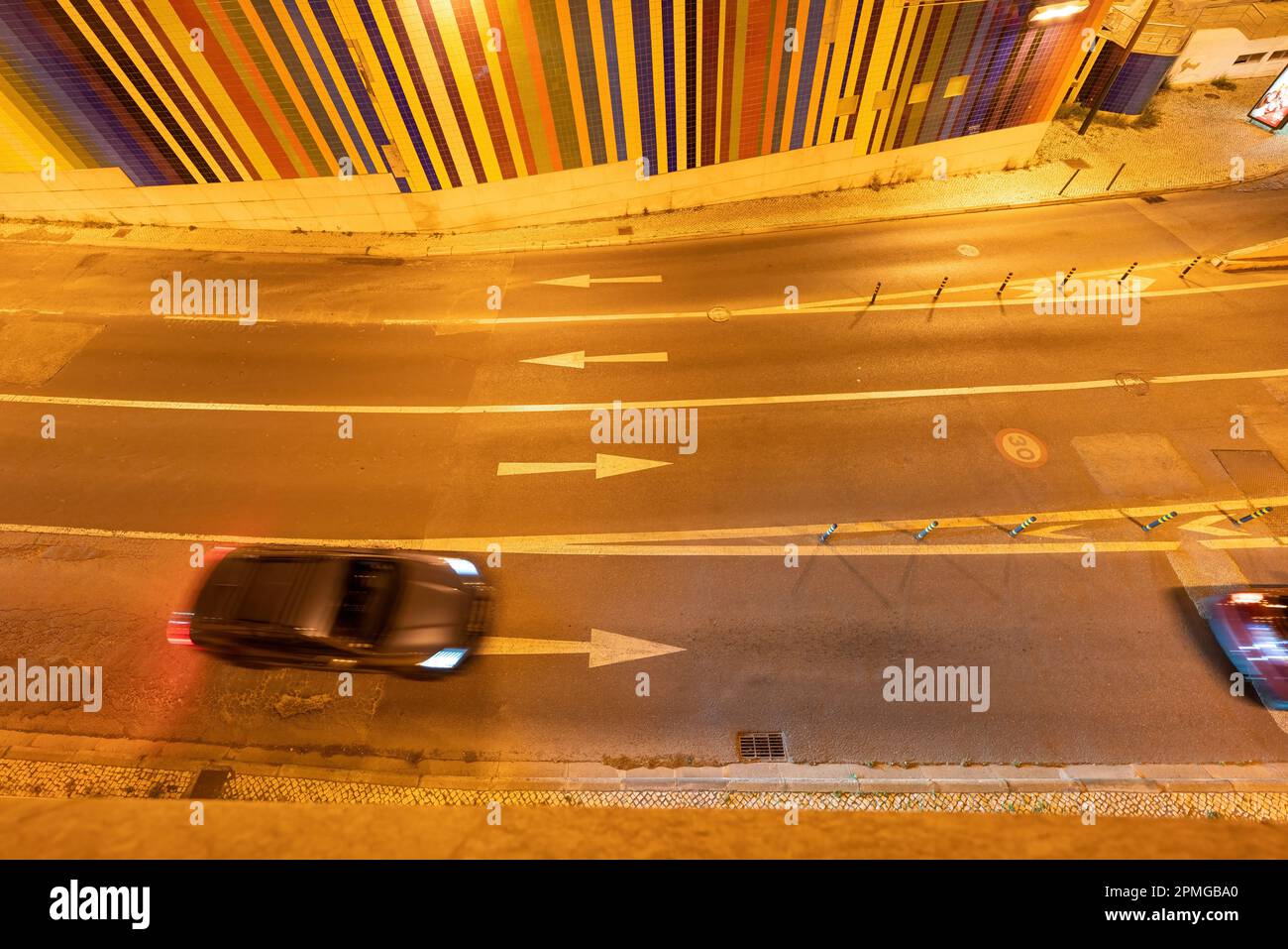 Road lanes with arrows and one car Stock Photo - Alamy