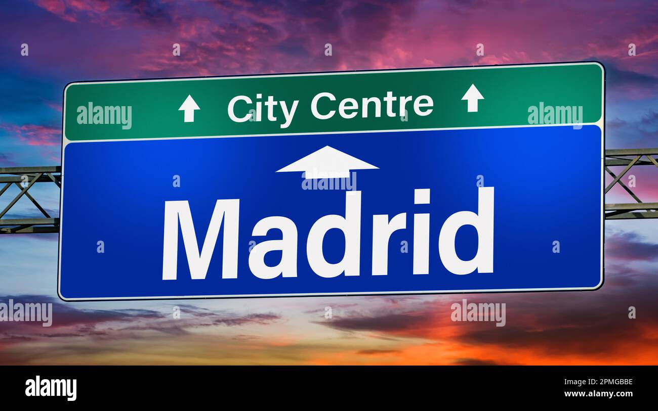 Road sign indicating direction to the city of Madrid Stock Photo - Alamy