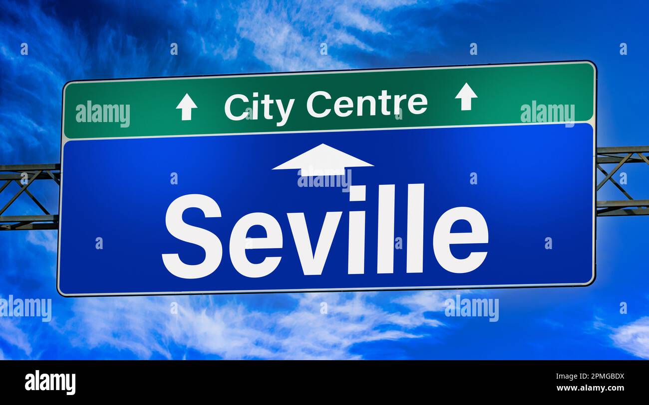 Road sign indicating direction to the city of Sevilla Stock Photo - Alamy