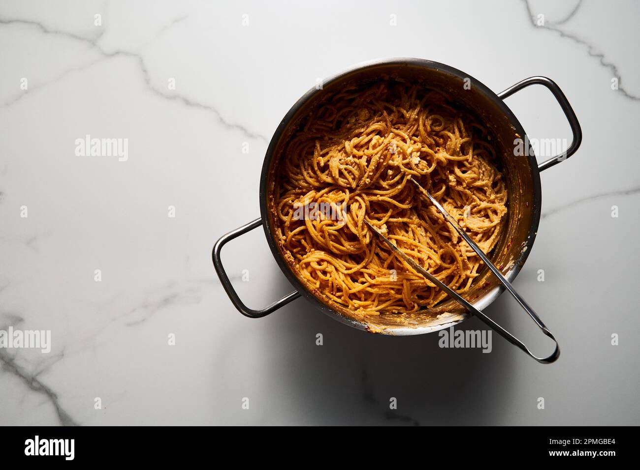 Pot of mexican pasta. Pasta with tomato sauce with chilli puree, feta ...