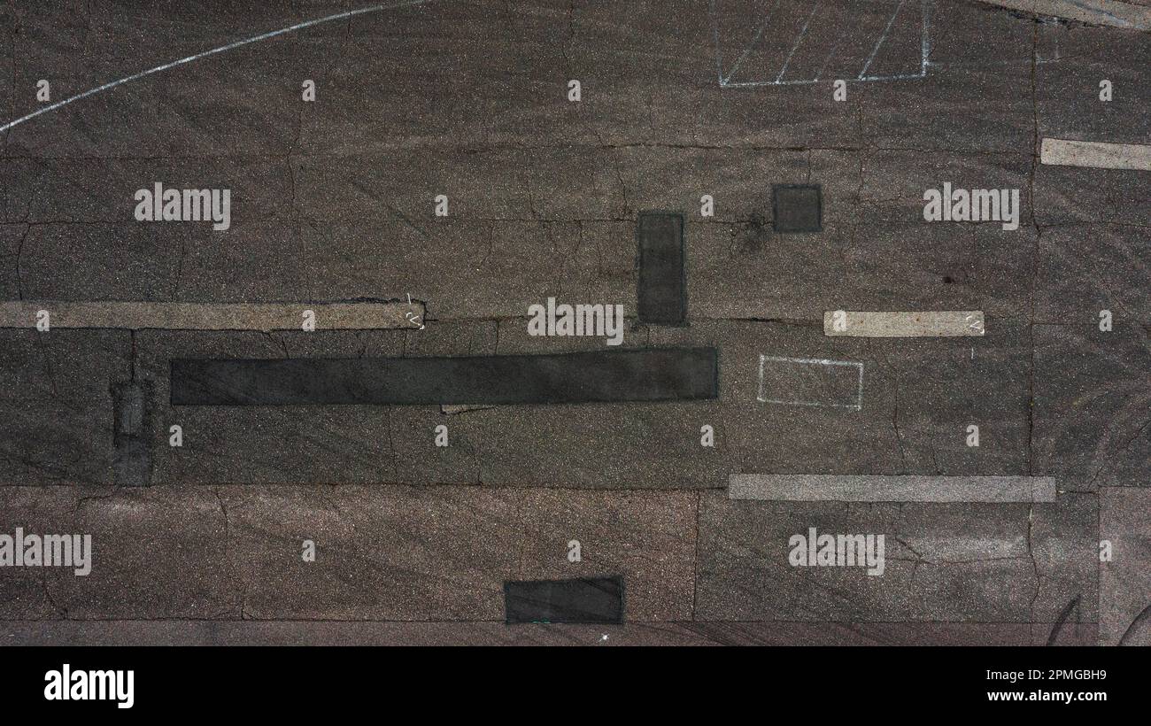 The texture of old and worn out asphalt. Drone view of old road Stock ...