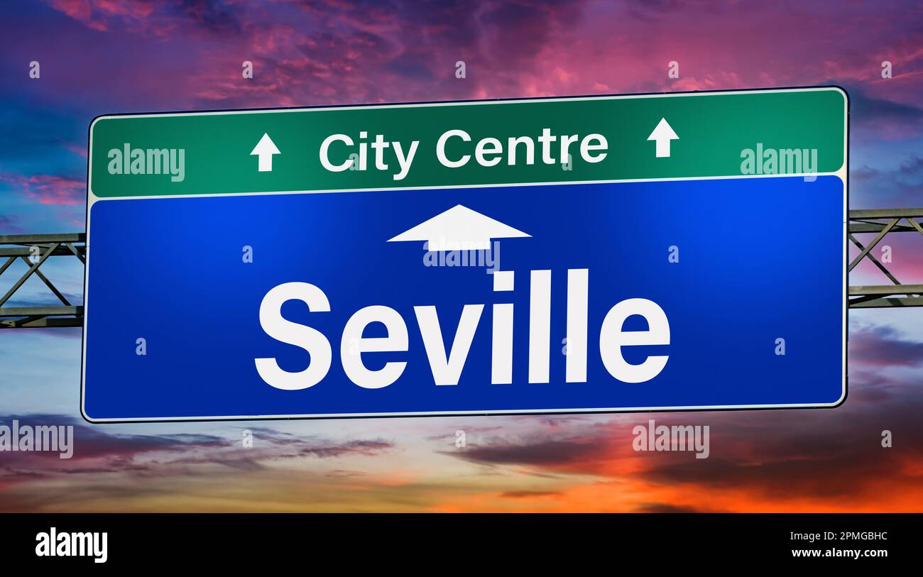 Road sign indicating direction to the city of Sevilla Stock Photo - Alamy