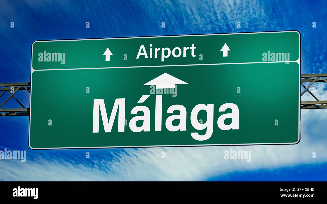 Road sign indicating direction to the city of Malaga Stock Photo - Alamy