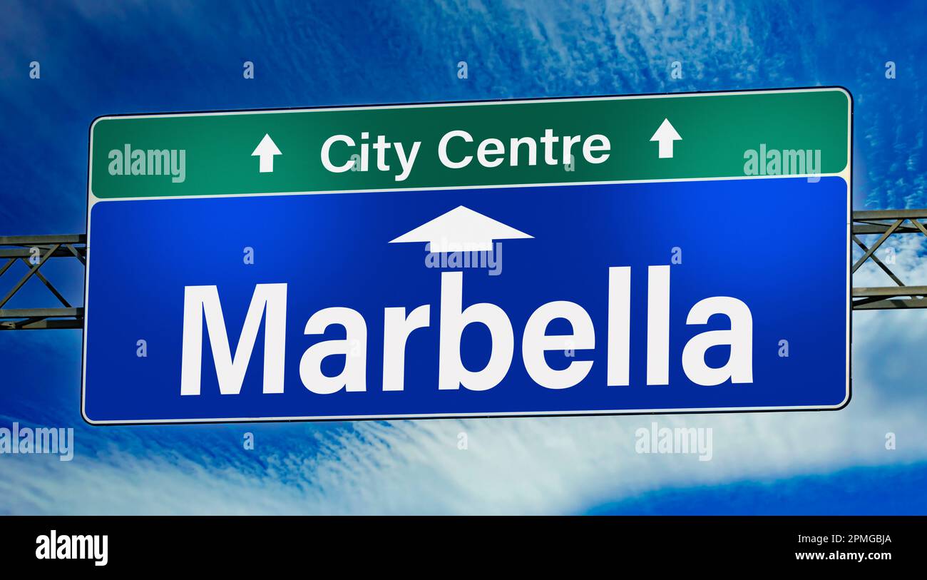 Road sign indicating direction to the city of Marbella Stock Photo - Alamy