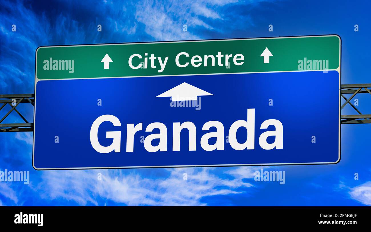 Road sign indicating direction to the city of Granada Stock Photo - Alamy