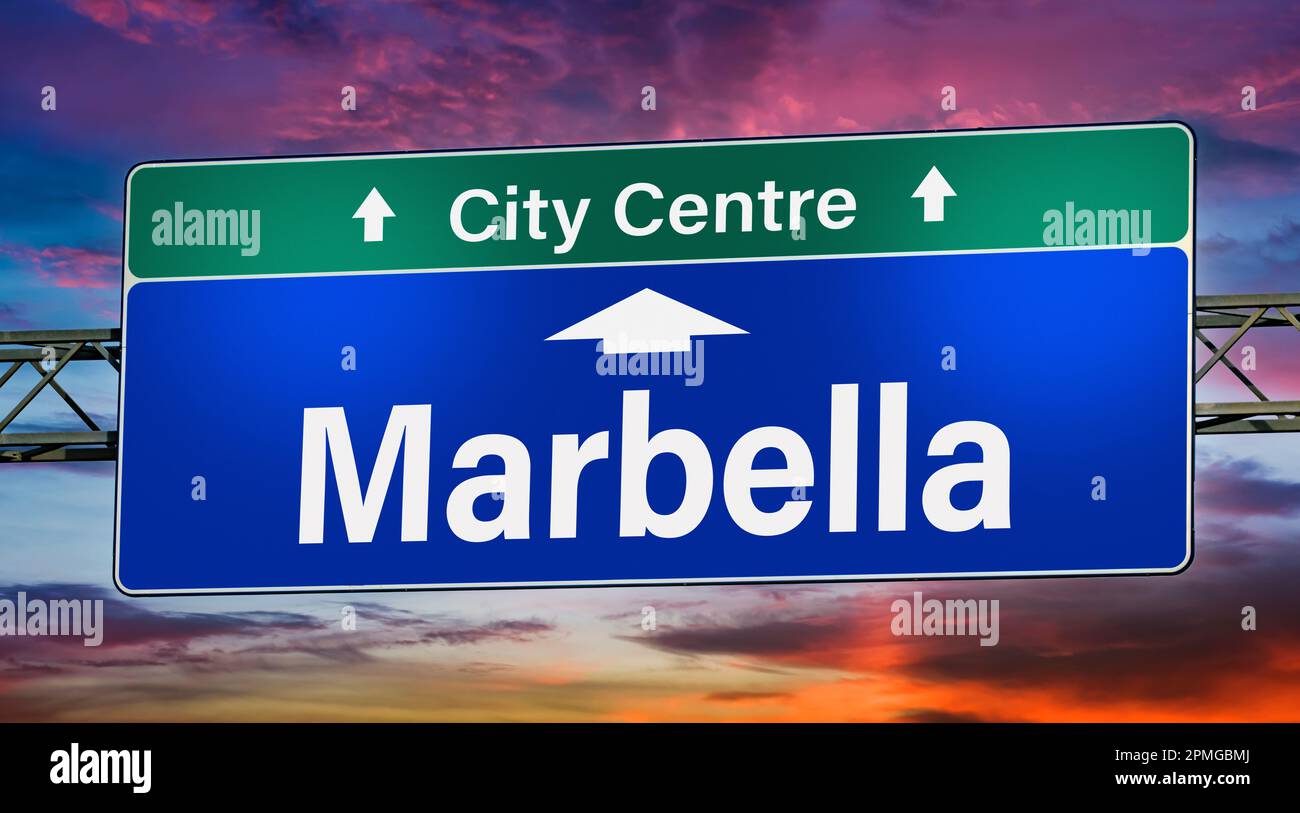 Road sign indicating direction to the city of Marbella Stock Photo - Alamy