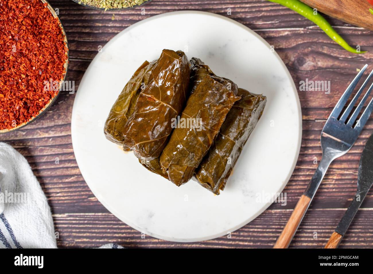 Olive oil leaf wrap. Aegean cuisine delicacies. Grape leaf wrap with ...