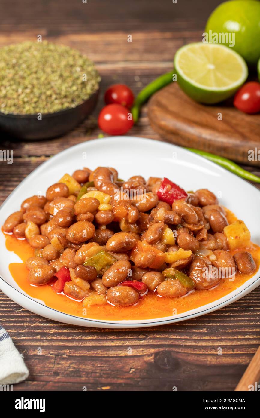 Red kidney beans dish with olive oil on wood floor. Healthy foods ...