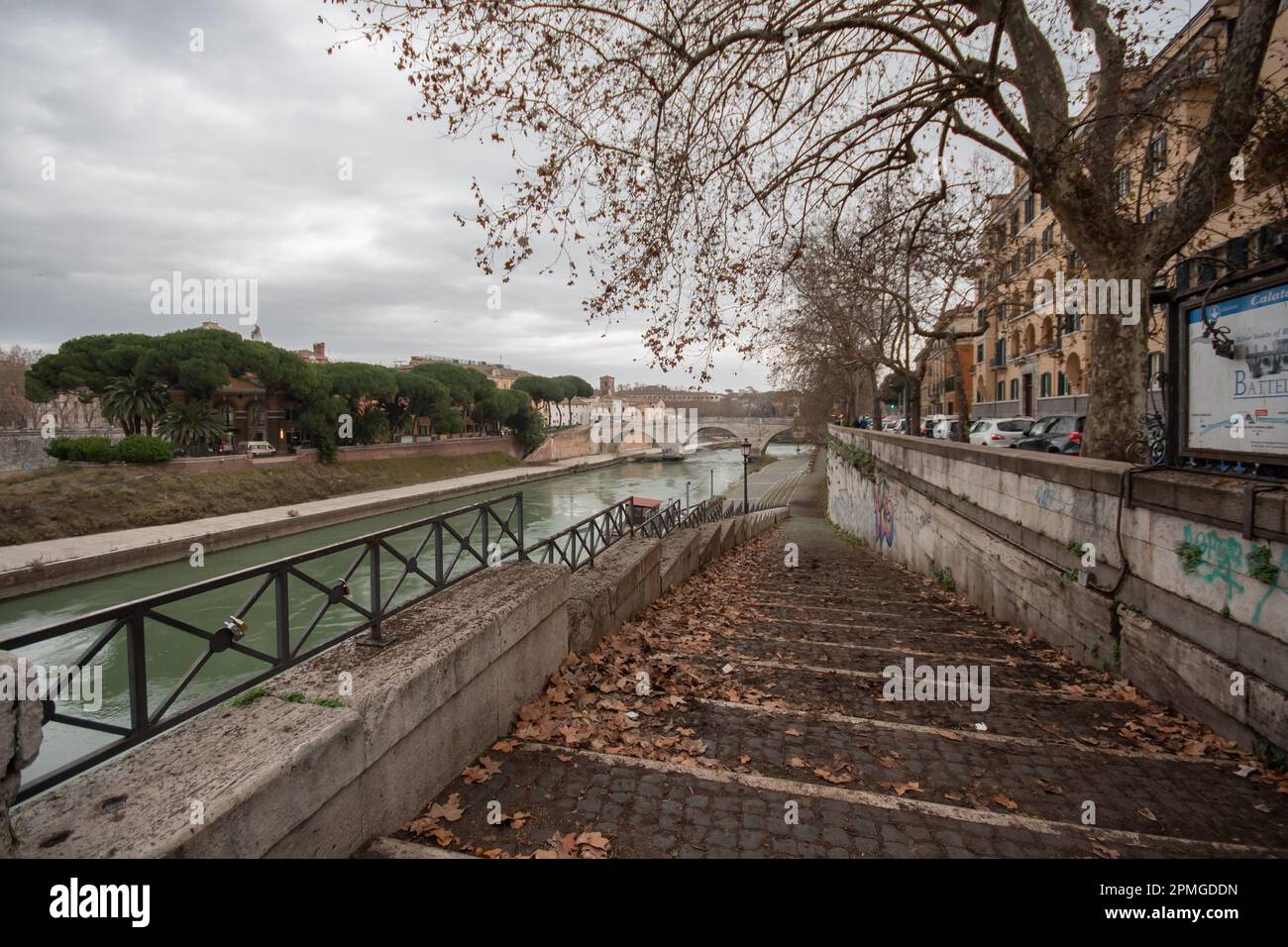 Large steps leading to the Tiber river bank with view of the Island ...