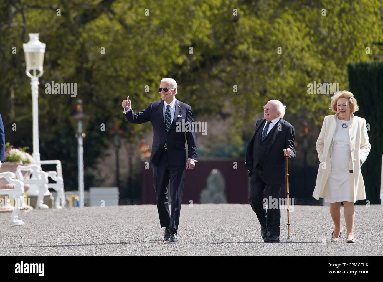 Irish President Michael D Higgins and his wife Sabina Higgins walk with ...