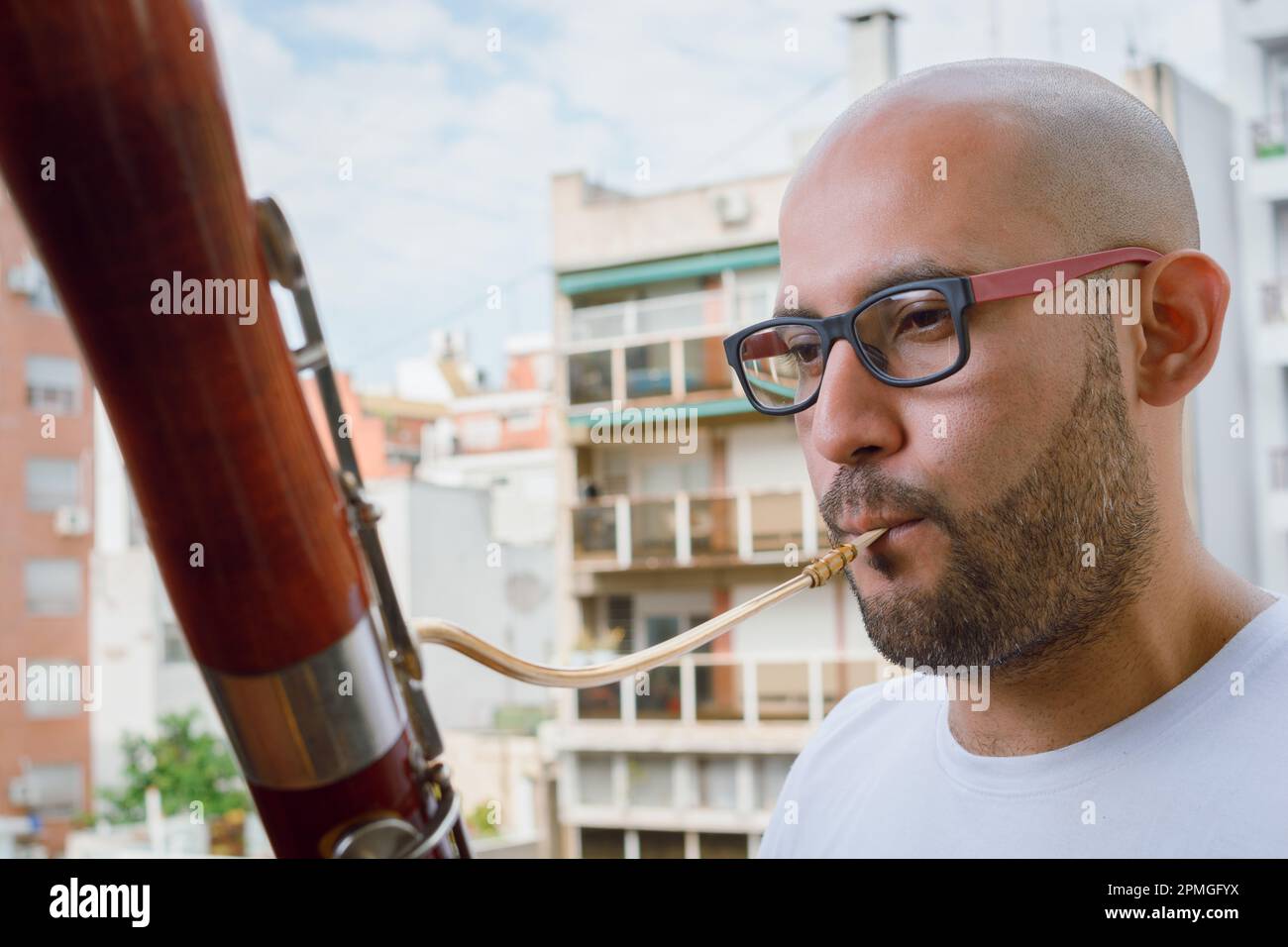 young latino venezuelan saxophonist man, with glasses, beard, white ...