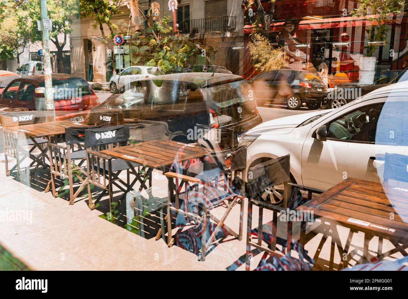 Reflection on the glass of a restaurant window on a street in the city ...